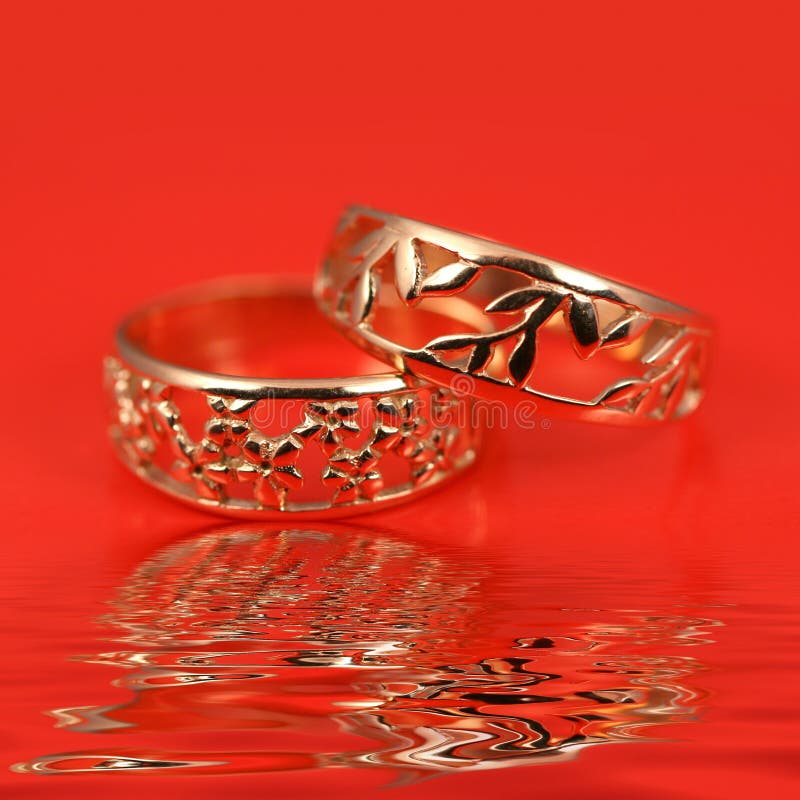 Wedding Rings on Red Background Stock Photo - Image of shining, gold ...