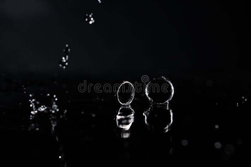Wedding Rings Reflection in the Mirror Stock Photo - Image of ...