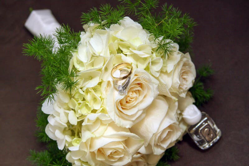 Wedding Rings on Roses stock image. Image of jewelry - 303803413