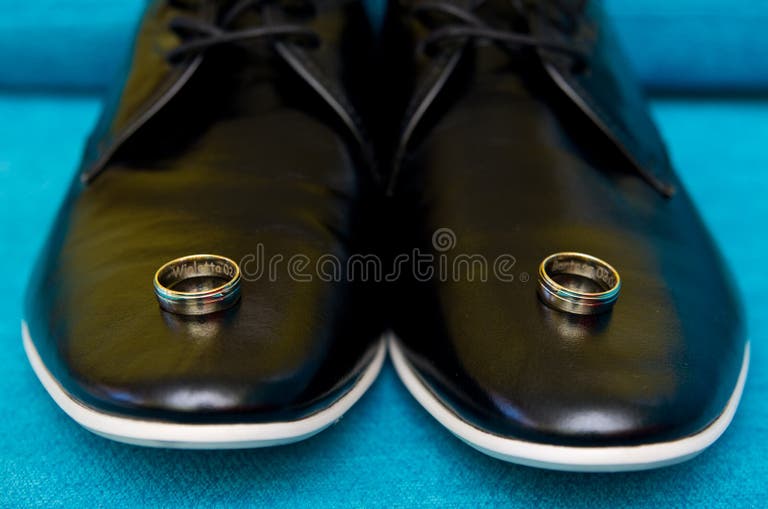Wedding rings on shoes stock photo. Image of symbols - 25280030