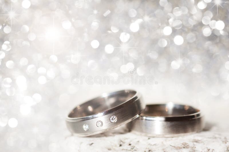 Wedding Rings on an Abstract Silver Glittering Bokeh Background Stock ...