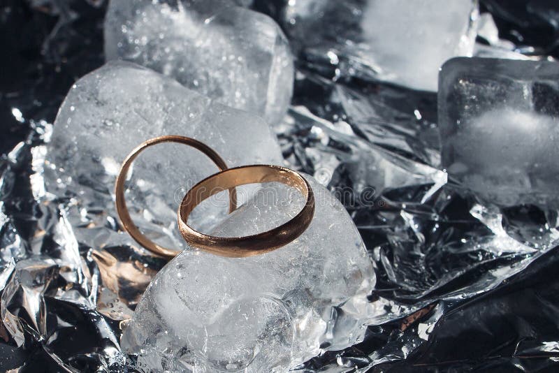 Wedding Rings with Splashes of Water and Pieces of Ice. Wedding Concept ...