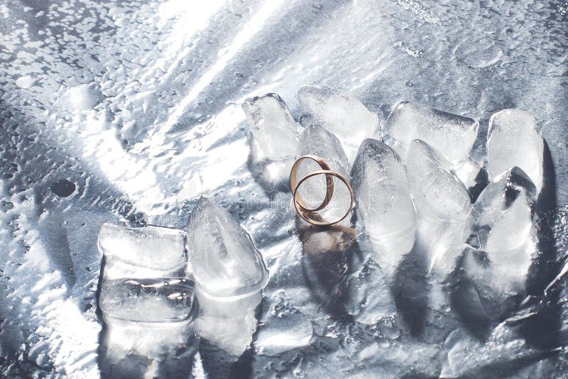 Wedding Rings with Splashes of Water and Pieces of Ice. Wedding Concept ...