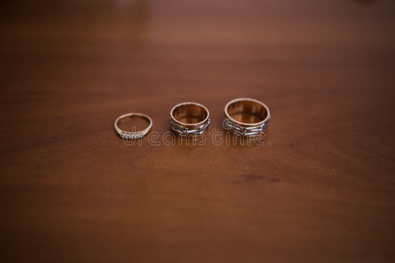 Wedding rings on the table stock image. Image of bride - 184720467