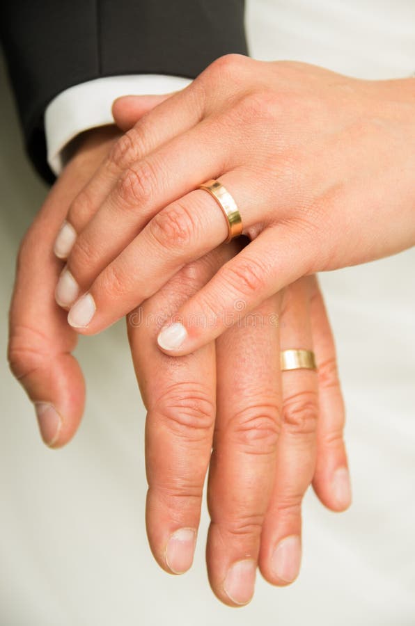 Wedding rings stock image. Image of hands, ring, symbol - 48397231