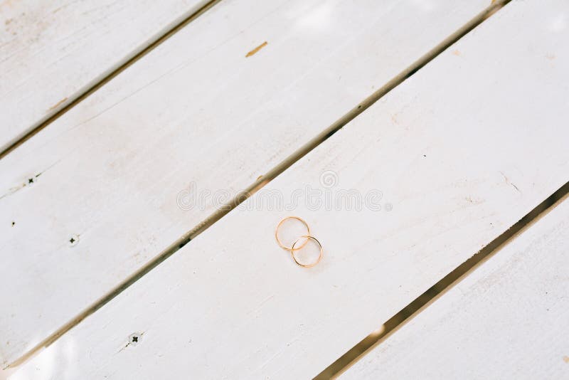 Wedding Rings on a White Wooden Texture Stock Photo - Image of luxury ...