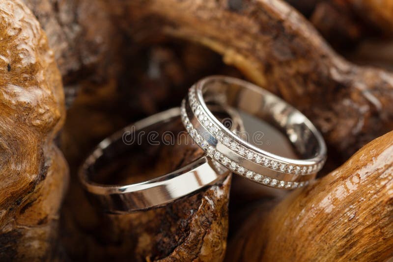 Wedding rings on wood stock image. Image of diamond, matrimony - 75259237