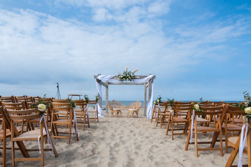 A Wedding Setting on a Beach Stock Photo - Image of arbor, flowers ...