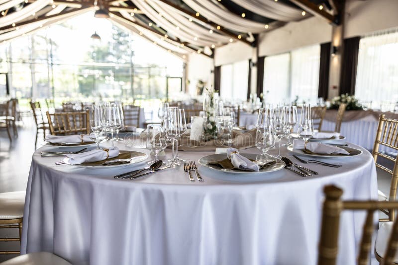 Wedding Setting and Decorated Tables in a Beautiful Modern Interior of ...