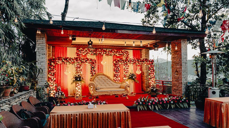 Wedding Stage Decorated in Red and Gold with White Garlands Stock Photo ...