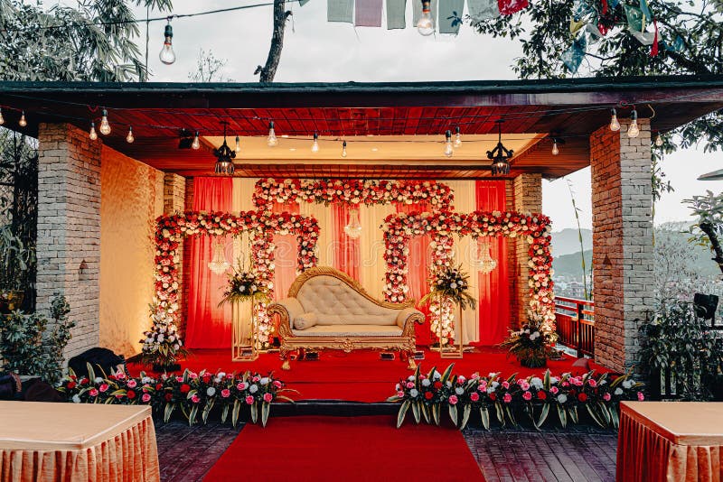 Wedding Stage Decorated in Red and Gold with White Garlands Stock Image ...