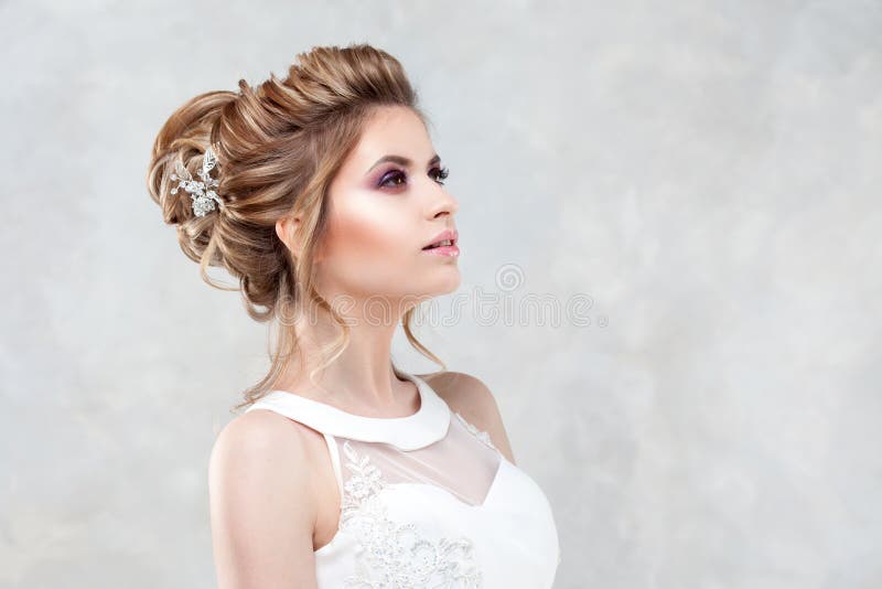 Young Beautiful Bride with an Elegant High Hairdo. Wedding Hairstyle ...
