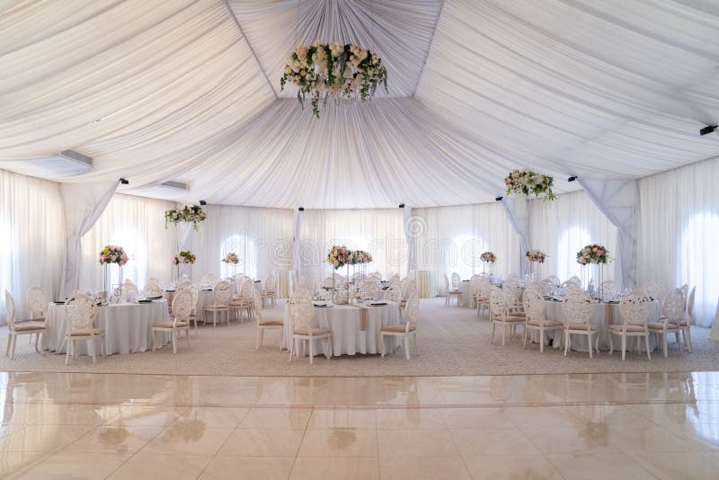 Wedding Tables in the Restaurant Hall with Beautiful Floral Decorations ...