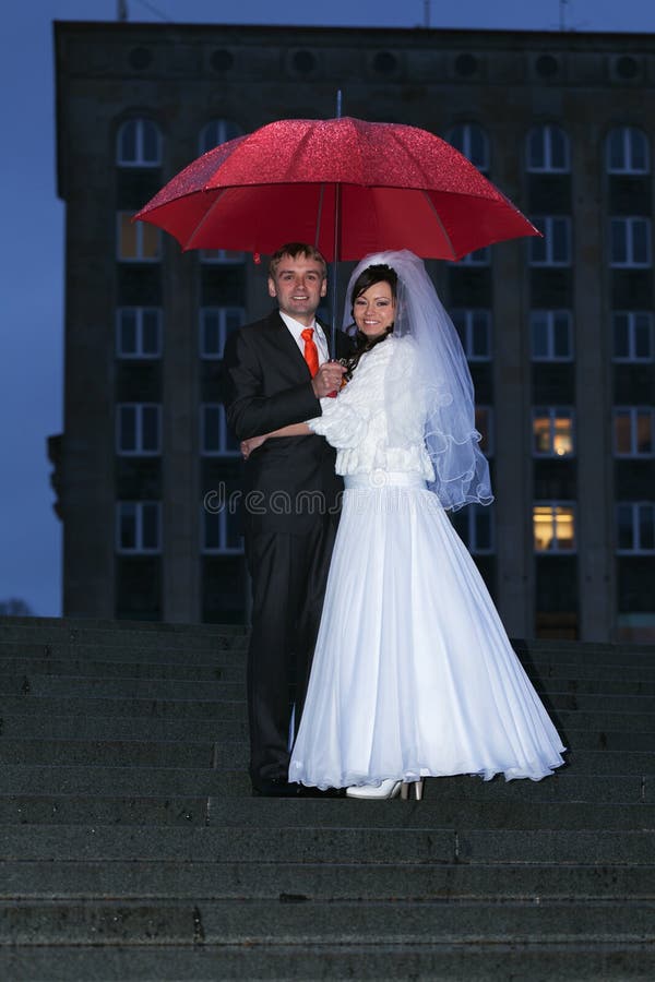 Wedding under the rain stock image. Image of protecting - 22950301
