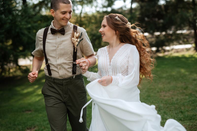 Wedding Walk of the Bride and Groom in a Coniferous Stock Photo - Image ...