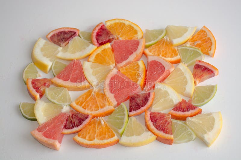 Wedges of Different Citrus Types on a Light Background Stock Image ...