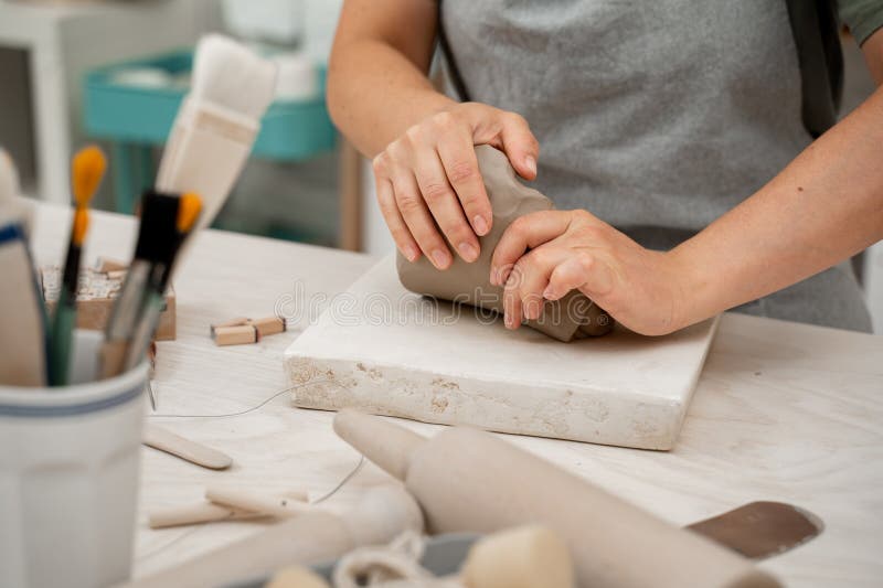 Wedging the Clay before Starting Making a Pottery Project To Create ...
