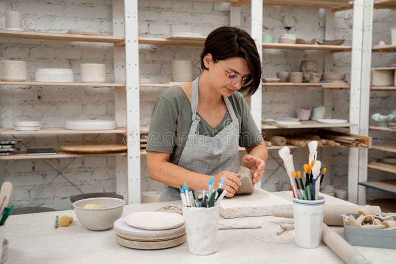 Wedging the Clay before Starting Making a Pottery Project To Create ...