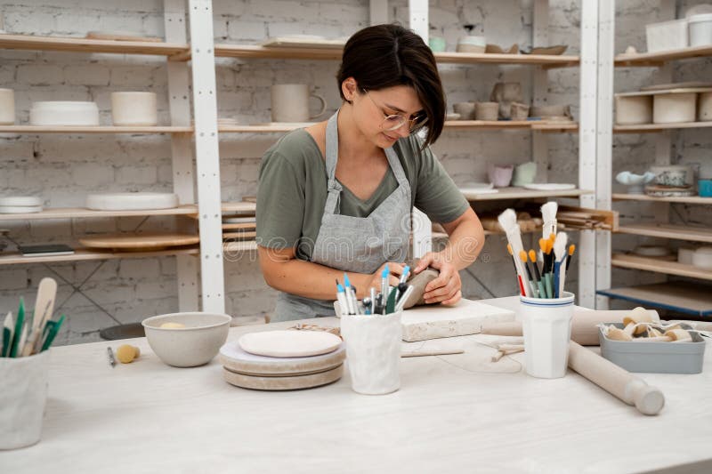 Wedging the Clay before Starting Making a Pottery Project To Create ...