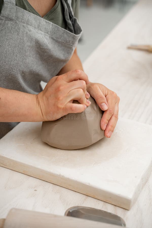 Wedging the Clay before Starting Making a Pottery Project To Create ...