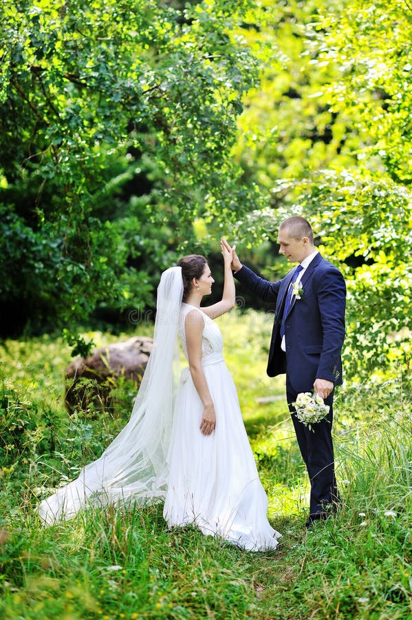 Weding Couple in a Green Park Stock Image - Image of playful, girl ...