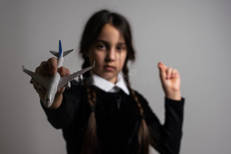 Wednesday Gothic Girl with Toy Airplane Stock Photo - Image of magic ...