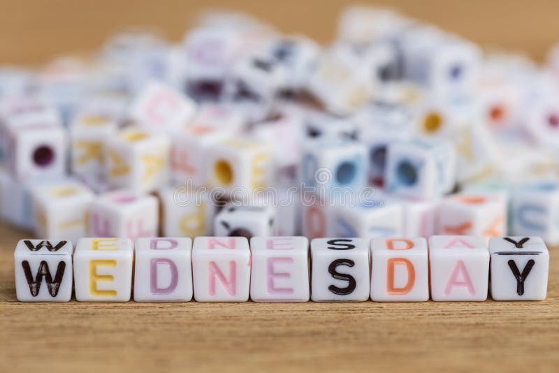 Wednesday Written in Letter Beads on Wood Background Stock Photo ...