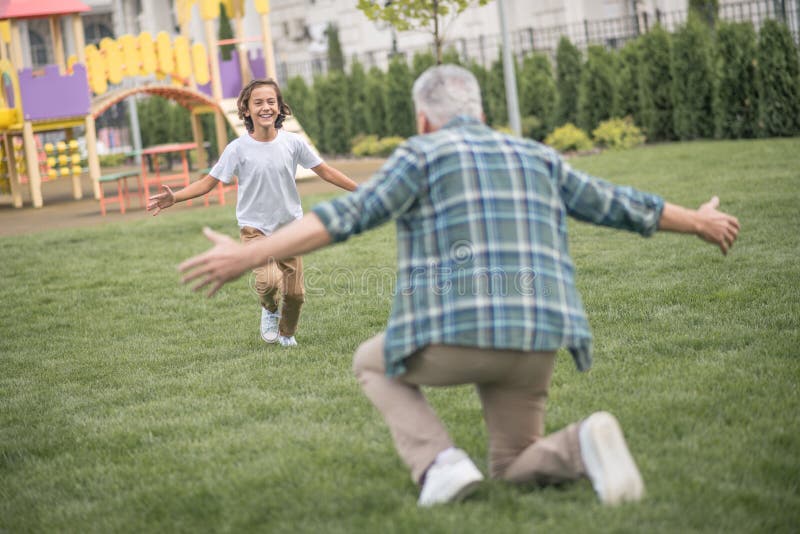 Boy Running To His Dad and Looking Happy Stock Image - Image of meeting ...