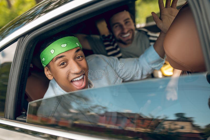 Group of Friends Driving in a Car and Looking Excited Stock Image ...