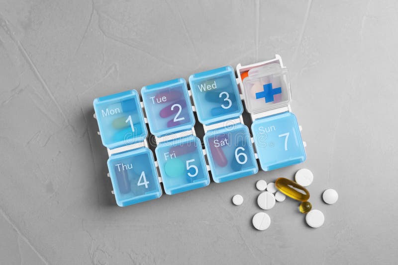 Weekly Pill Box with Medicaments on Grey Table, Flat Lay Stock Photo ...