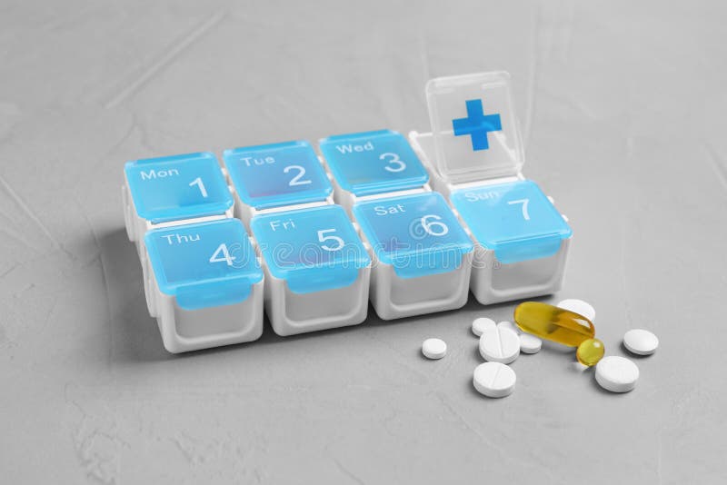 Weekly Pill Box with Medicaments on Grey Table Stock Image - Image of ...