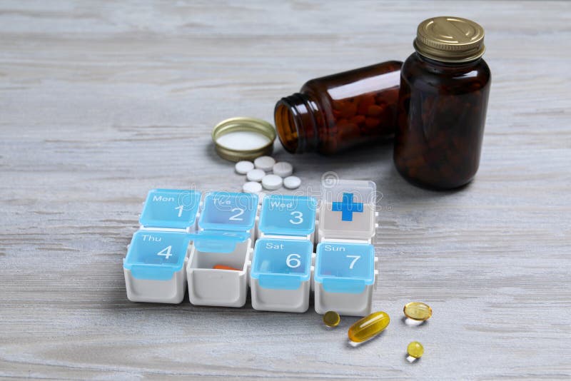 Weekly Pill Box with Medicaments on Wooden Table Stock Image - Image of ...