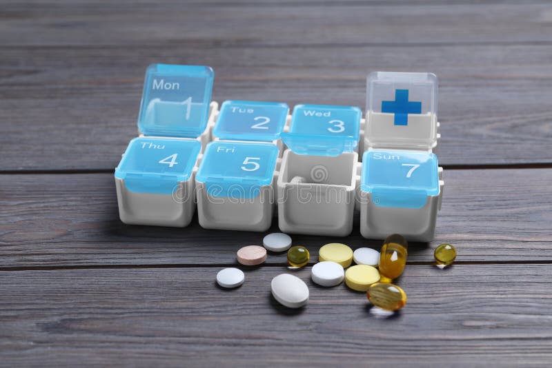Weekly Pill Box with Medicaments on Wooden Table Stock Photo - Image of ...