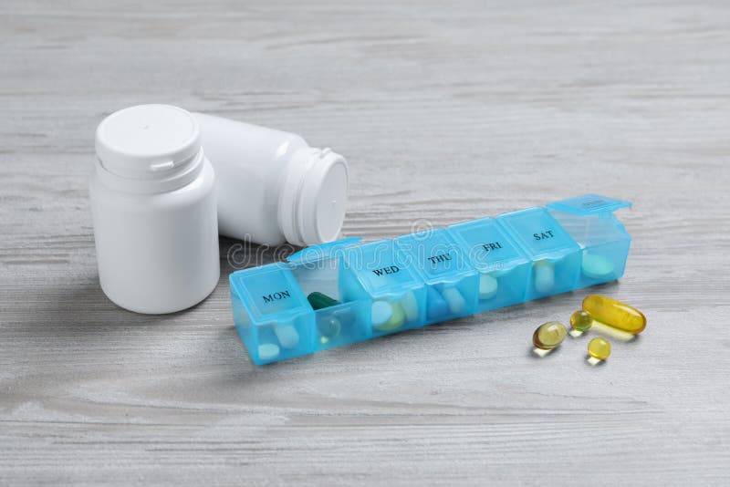 Weekly Pill Box with Medicaments on Wooden Table Stock Image - Image of ...