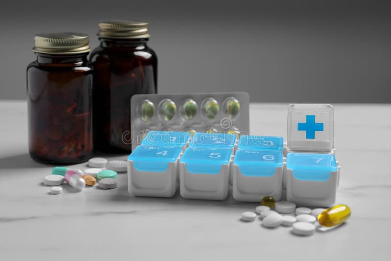 Weekly Pill Box with Medicaments on White Marble Table Stock Image ...