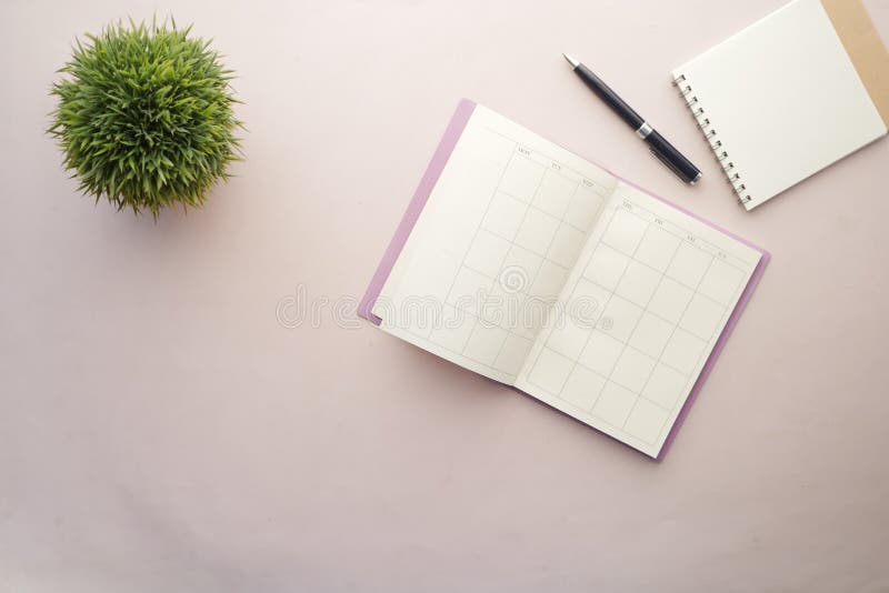 Weekly Planner and Notepad on Table Stock Photo - Image of calendar ...