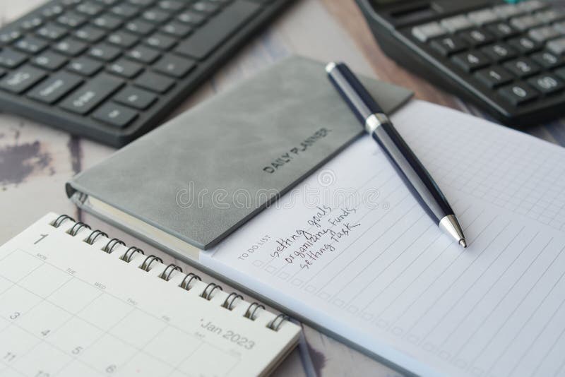 Weekly Planner and Notepad on Table Stock Photo - Image of planning ...