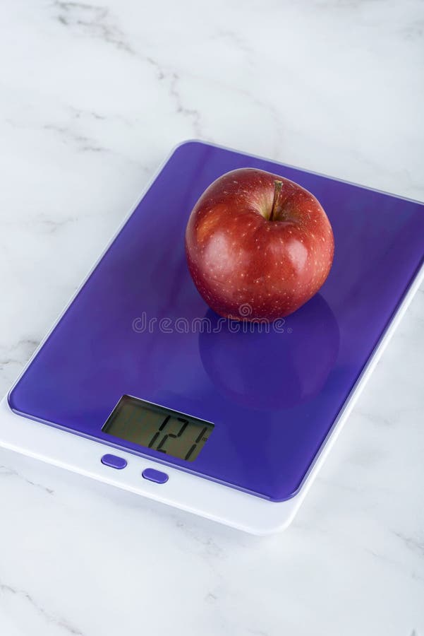 Weigh a Red Apple on a Purple Kitchen Scale. Stock Image - Image of ...