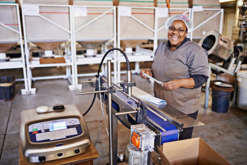 Weighed Up for Profit. Shot of a Factory Worker Using an Industrial ...