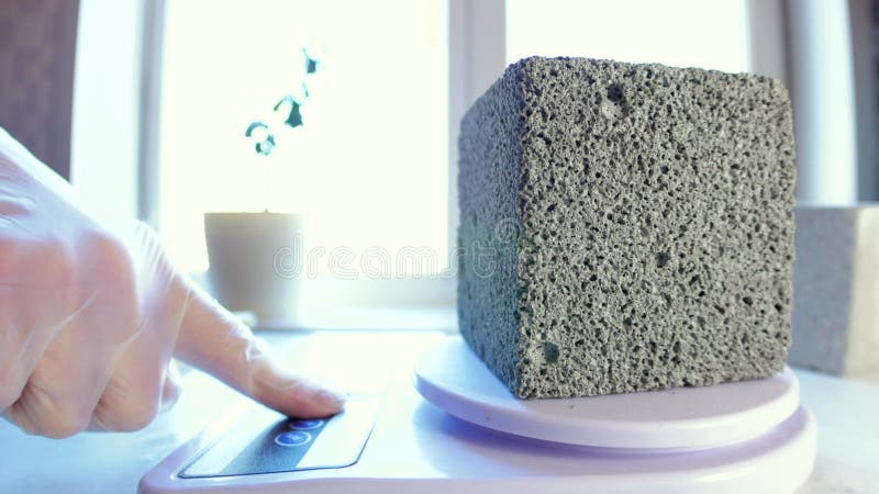 Weighing a Cube of Foam Concrete in the Laboratory Stock Video - Video ...