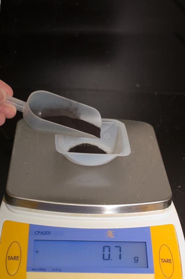 Weighing dark powder stock photo. Image of light, spoon - 1148628