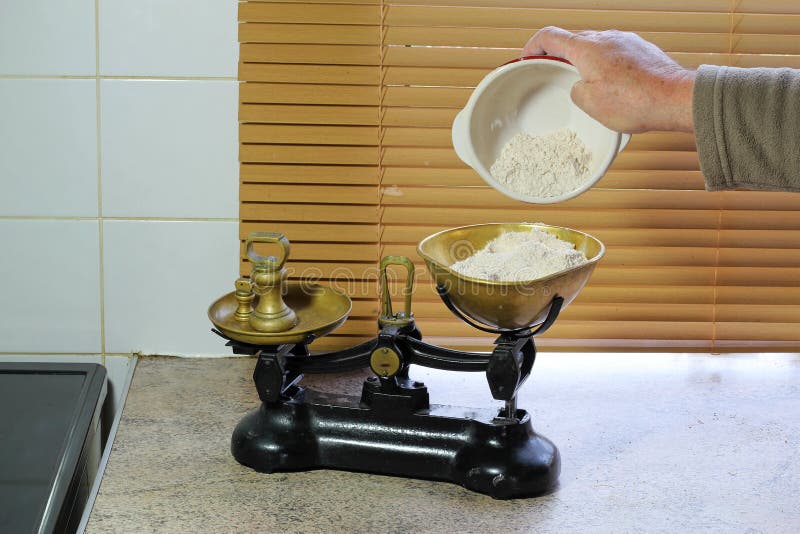 Weighing flour in scales stock image. Image of weights - 36838879