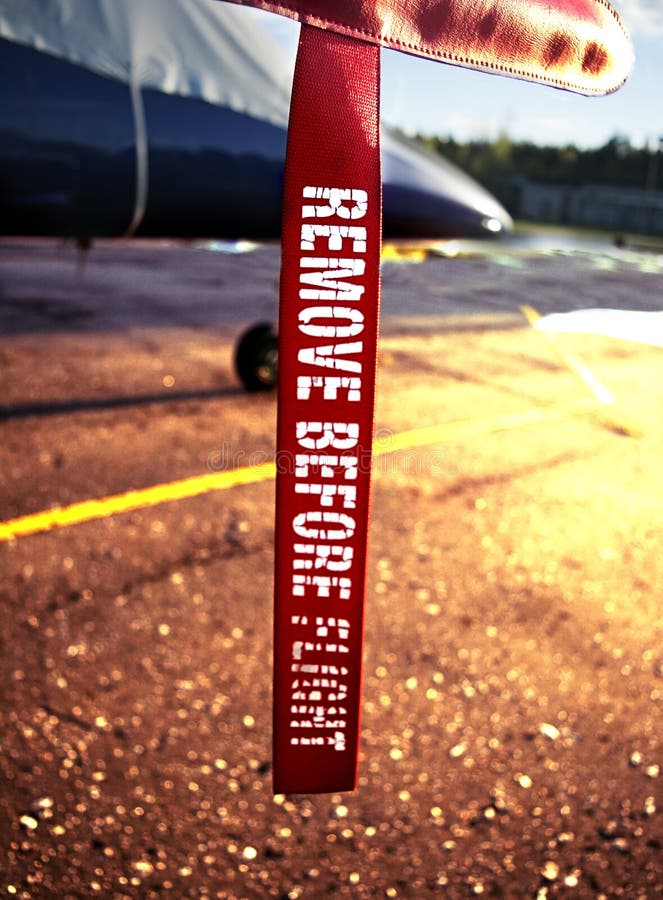 Remove before the Flight Red Stock Image - Image of plane, ribbon ...