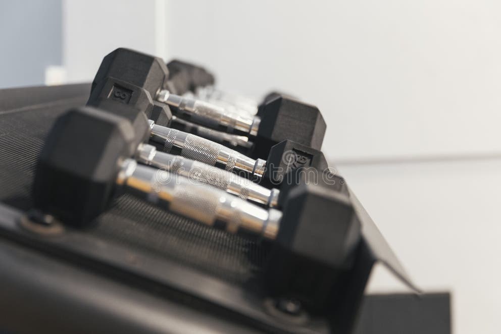 Bench with 4 small weights stock image. Image of muscular - 258550743