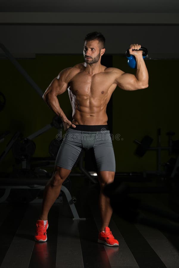 Weight Exercise with Kettle-bell Stock Image - Image of adult, lighting ...