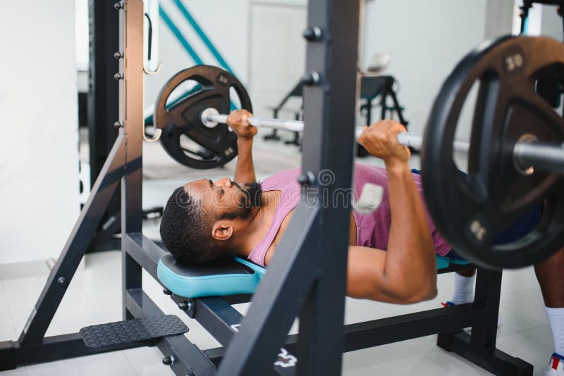 Weight Lifter at the Bench Press Lifting a Barbell on an Bench. Stock ...