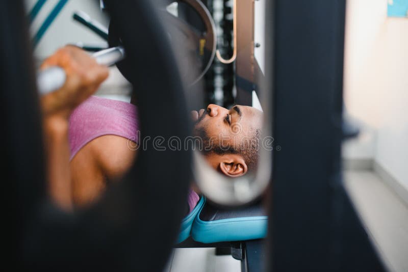 Weight Lifter at the Bench Press Lifting a Barbell on an Bench. Stock ...
