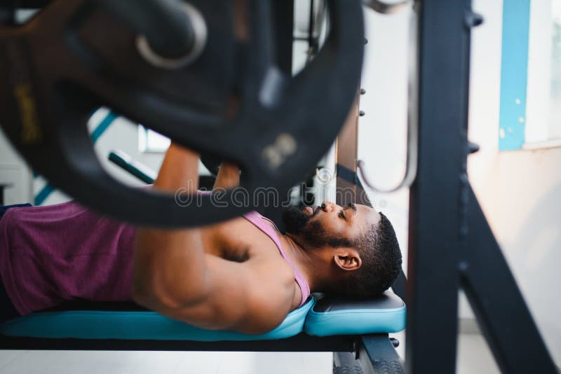Weight Lifter at the Bench Press Lifting a Barbell on an Bench. Stock ...