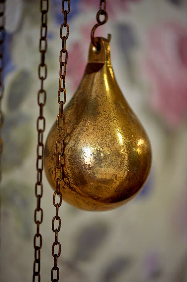 The Weight or Load on Old Retro Clock on a Chain.Close. Metal or Bronze ...