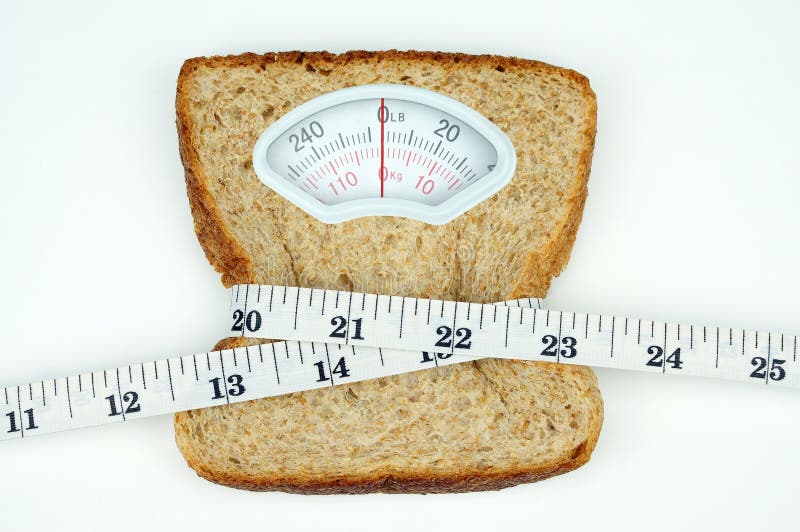 Weight Scale with Wholesome Slice of Bread and Measuring Tape on Stock ...